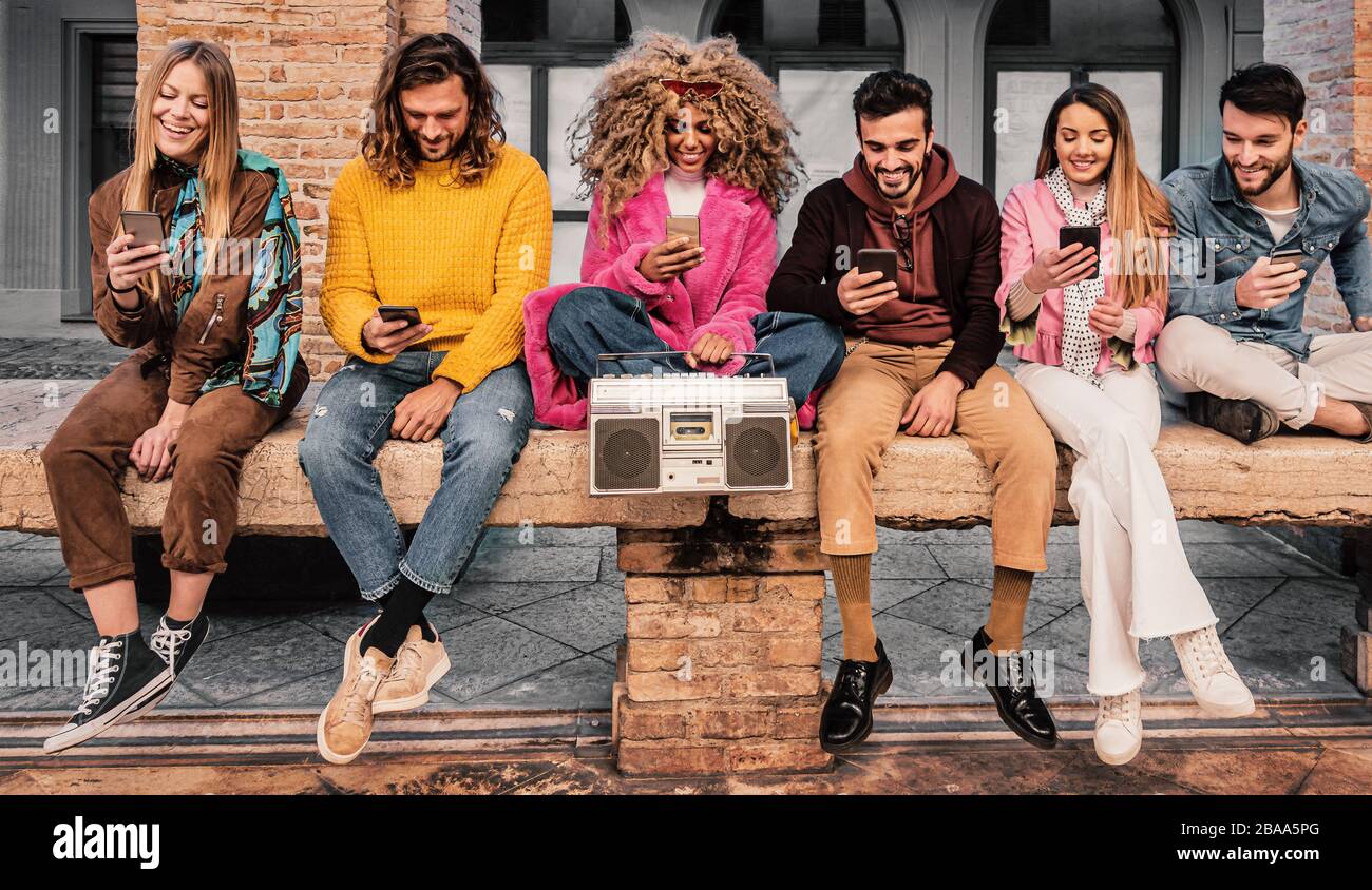 Young people having fun using their smartphones Stock Photo - Alamy