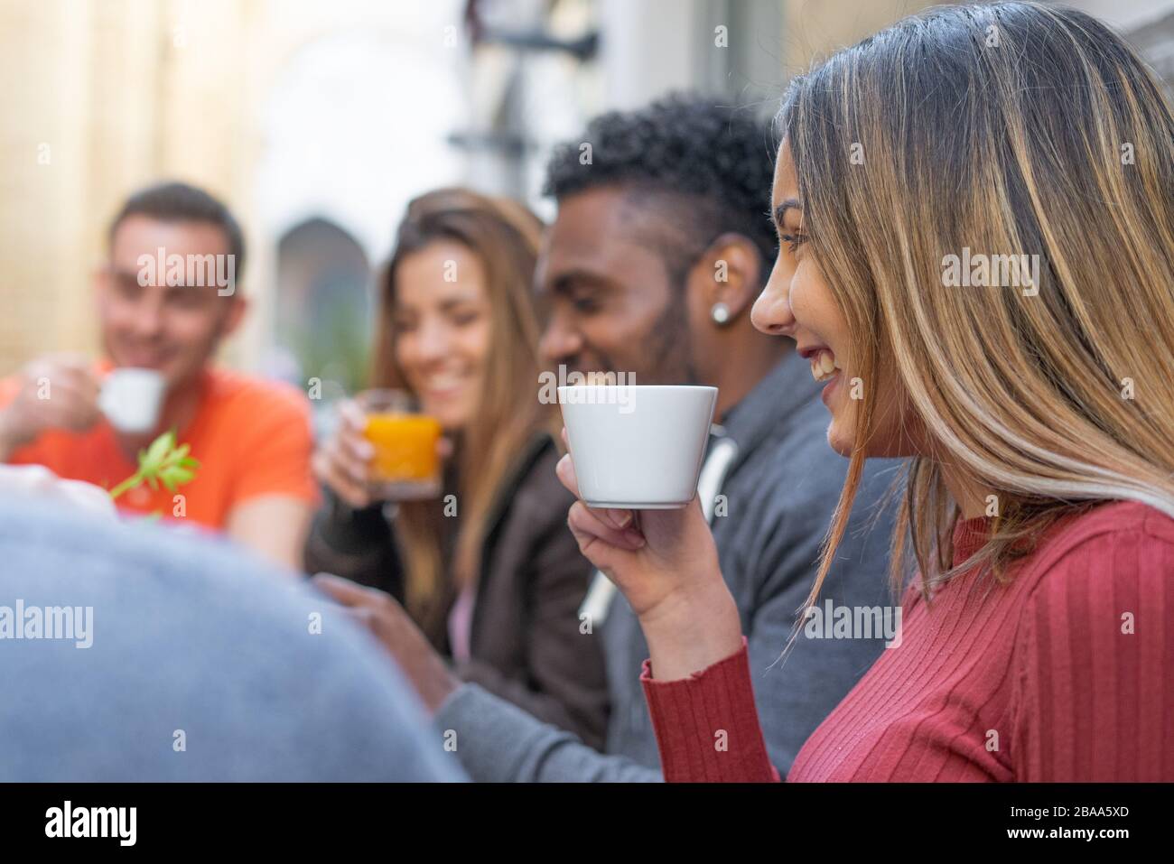 Multi ethnic millennials spending time in coffee shop. Young people ...