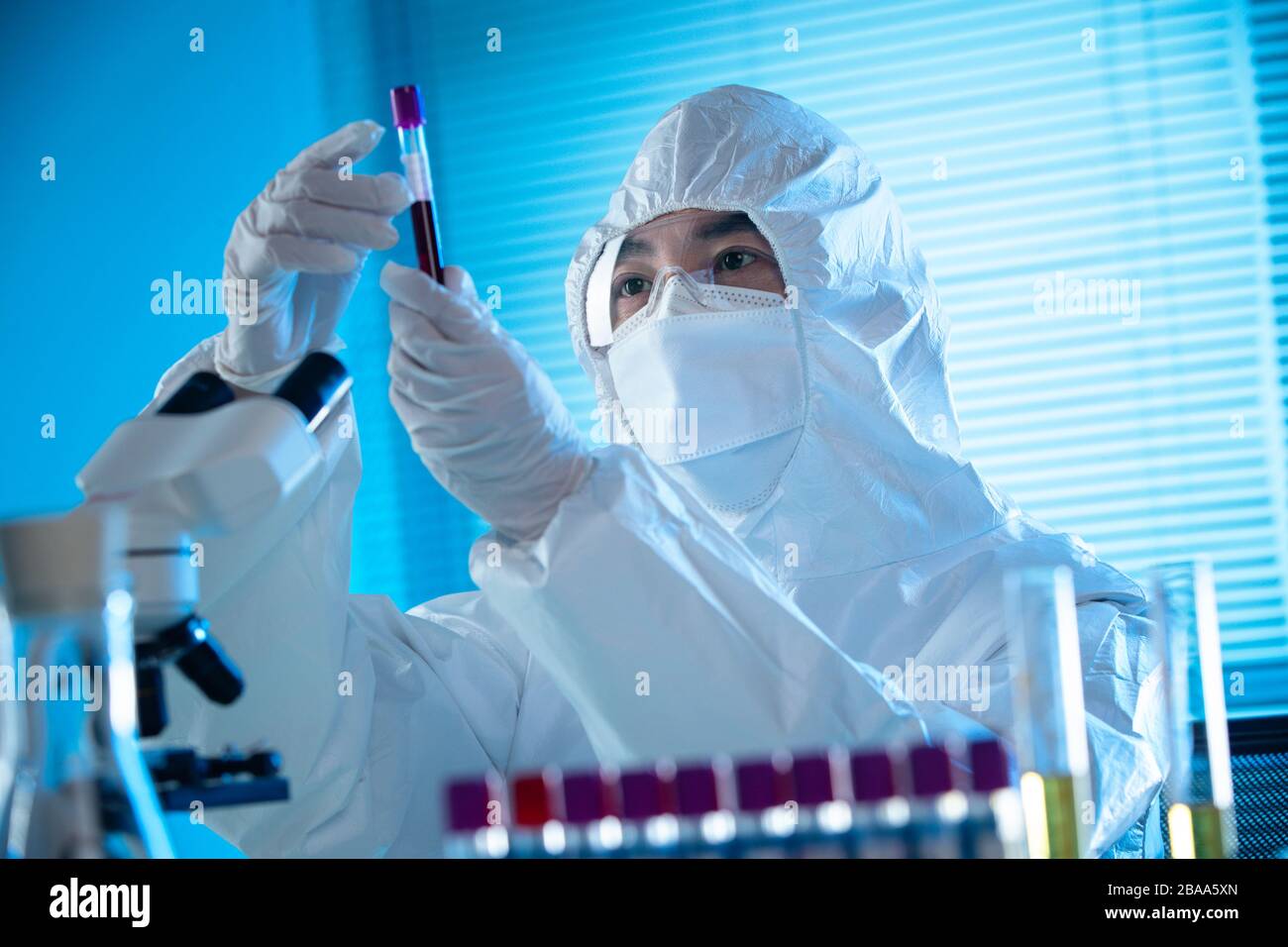 Medical workers with test tubes for testing Stock Photo - Alamy
