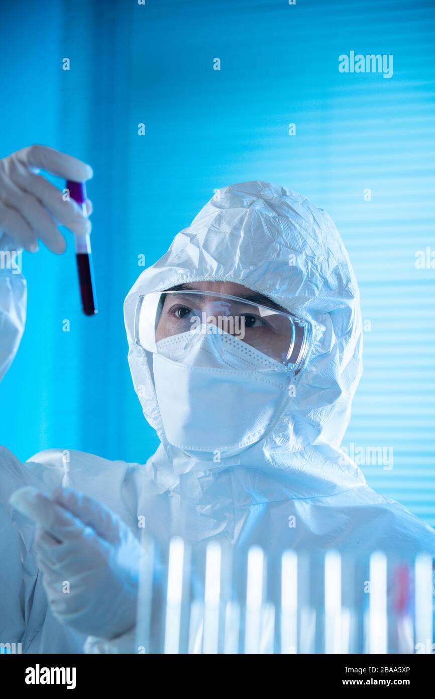 Medical workers with test tubes for testing Stock Photo - Alamy