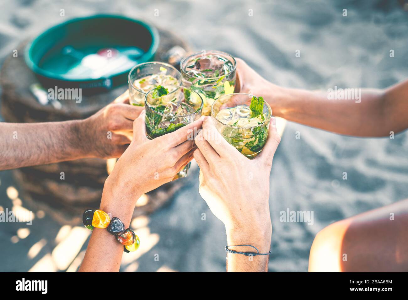 Best friends toasting with cocktails. Young people drinking at aperitif ...