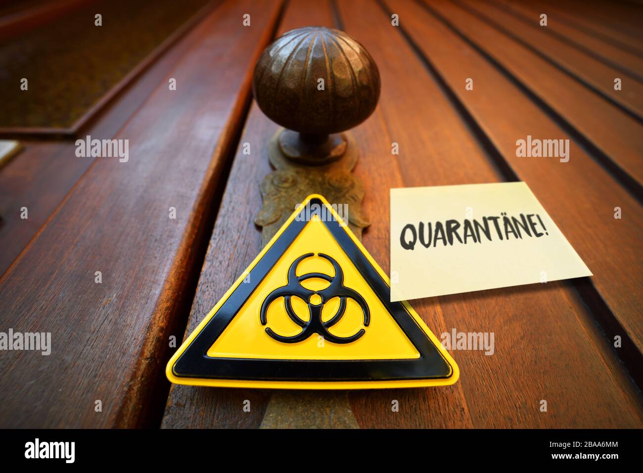 PHOTOMONTAGE, biology danger sign and note slip of paper with label ...