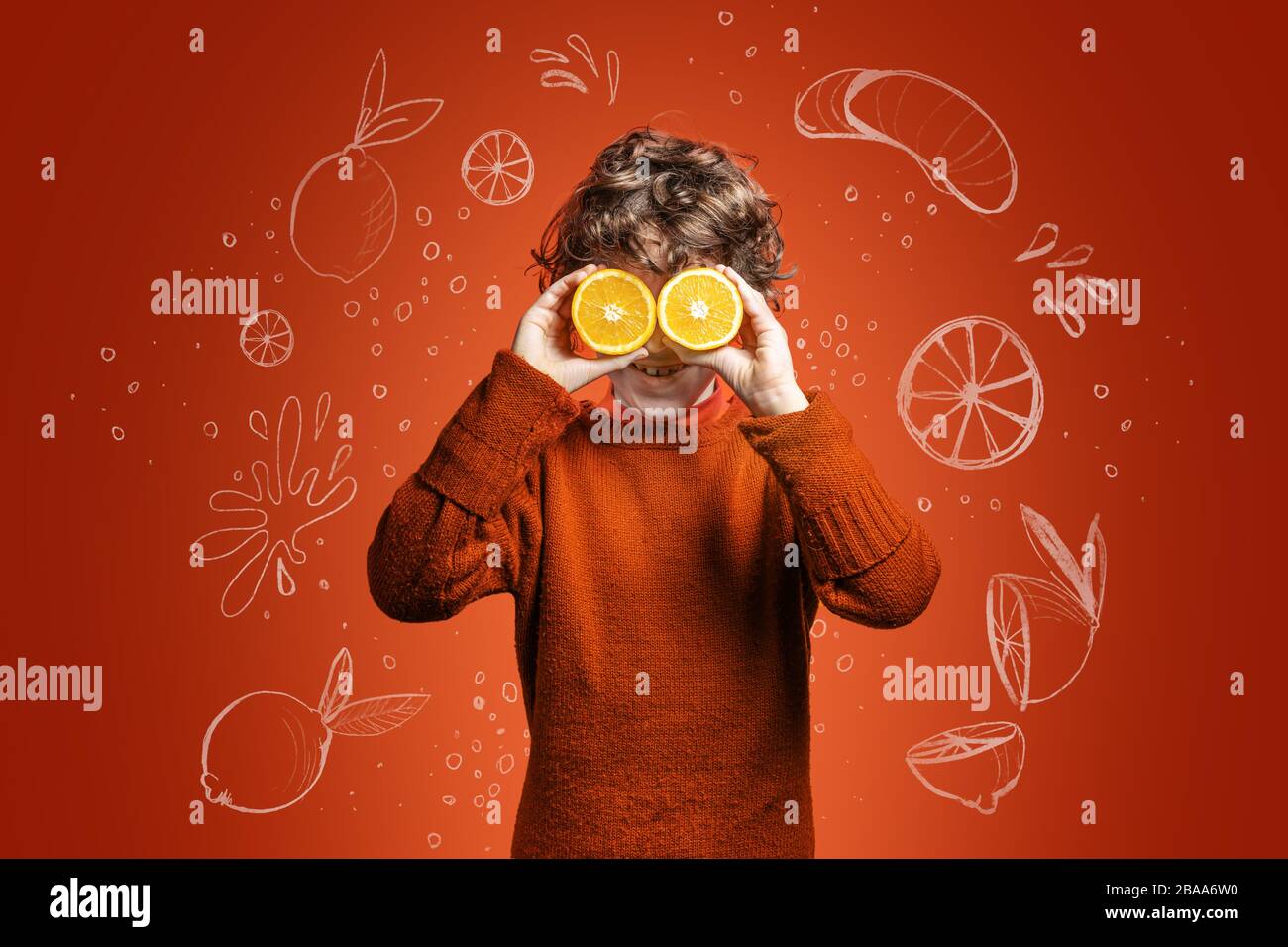 Elementary age kid having fun with oranges. Child with eyes covered ...
