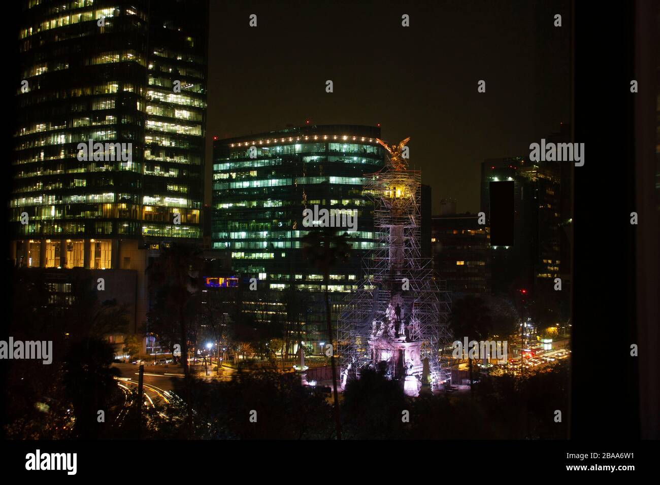 Streets of Mexico City at night painted with golden lights illuminating ...