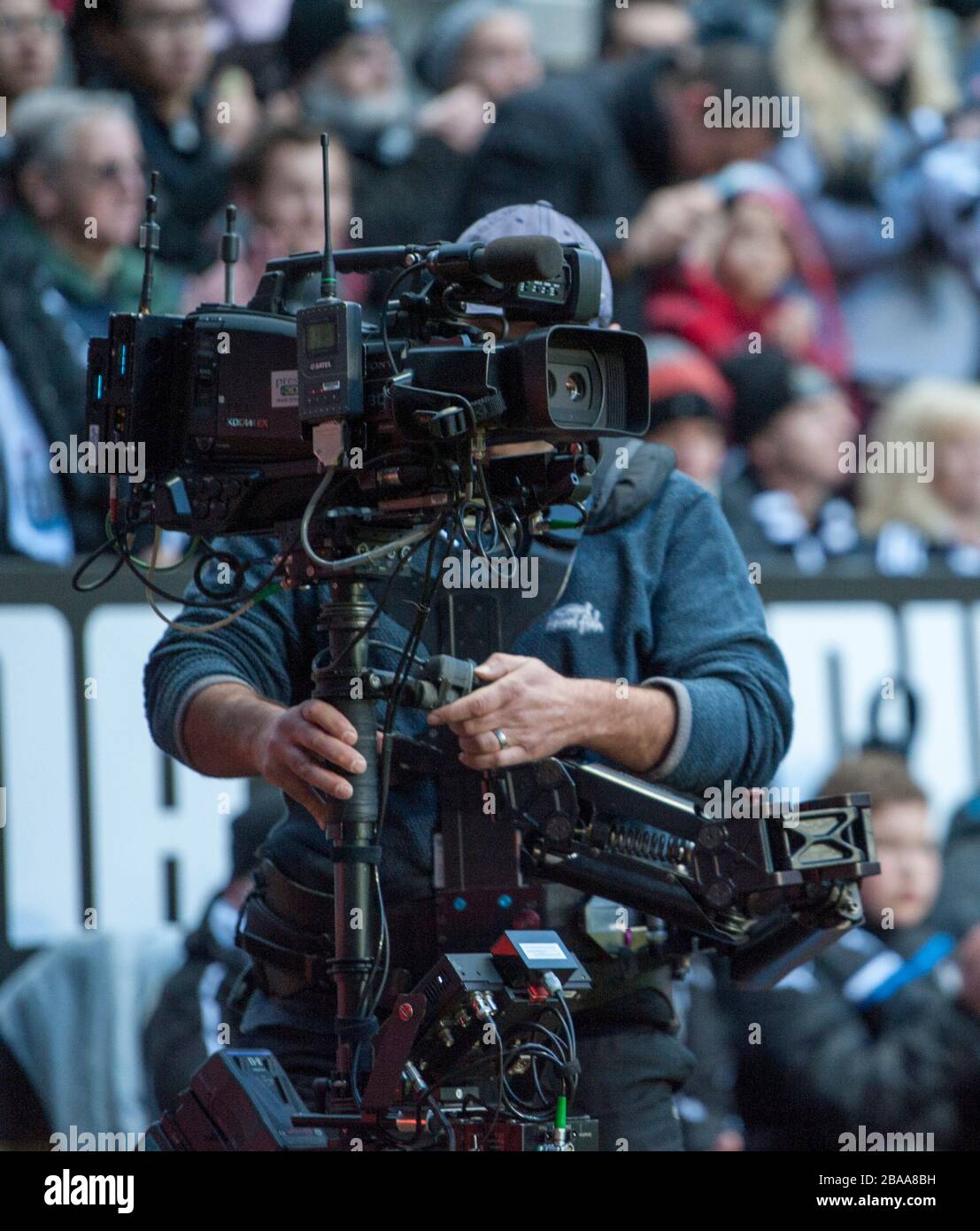 A video cameraman films the game Stock Photo - Alamy