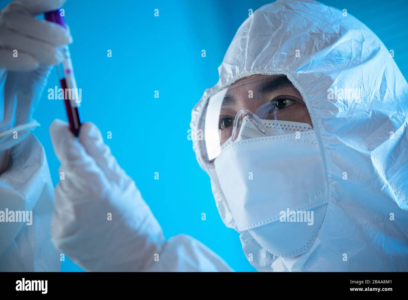Medical workers with test tubes for testing Stock Photo - Alamy