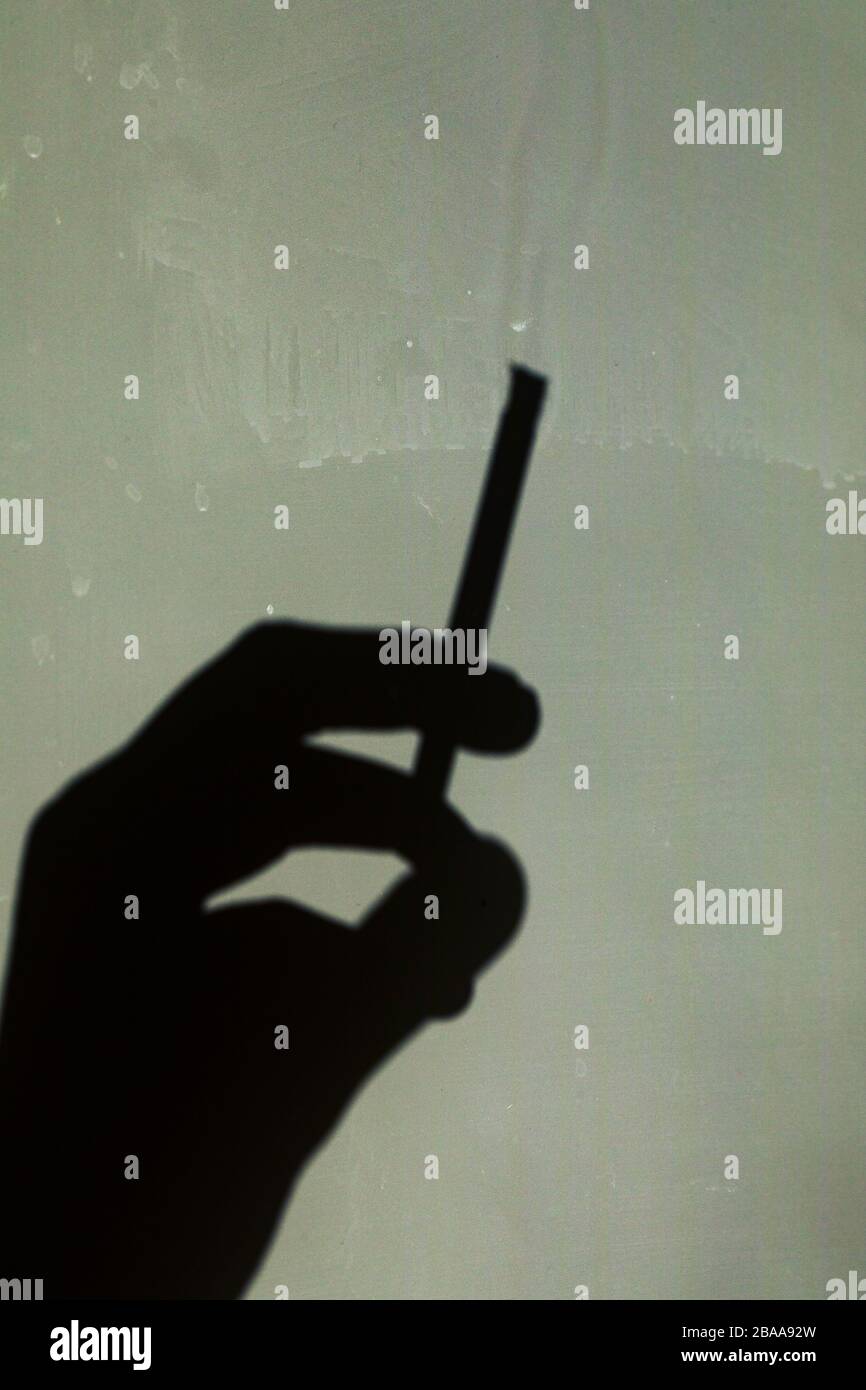 Man and shadow and cigarette hi-res stock photography and images - Alamy