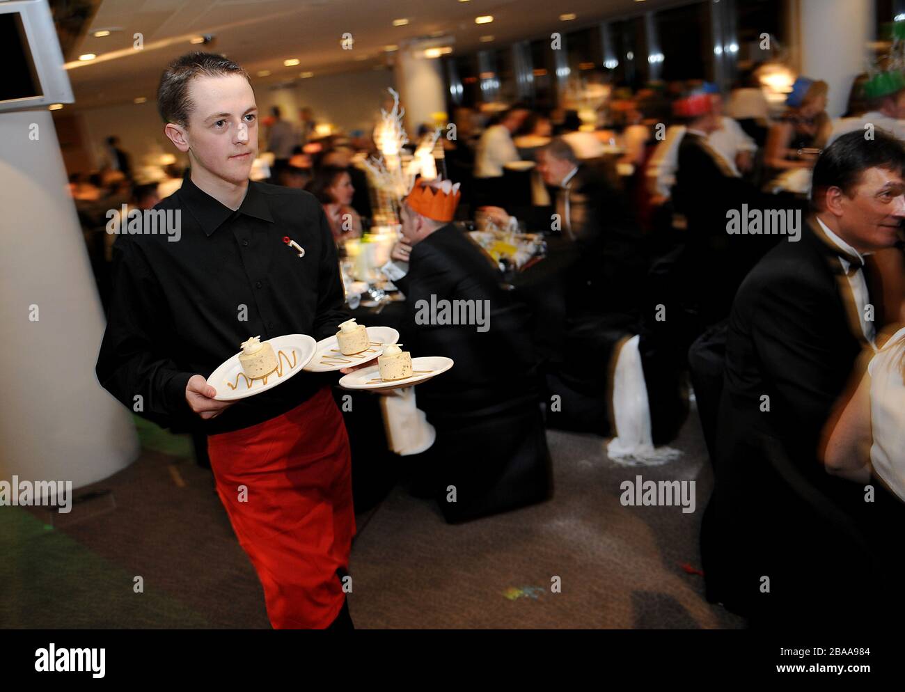 Waiting staff deliver food to guest's tables Stock Photo - Alamy