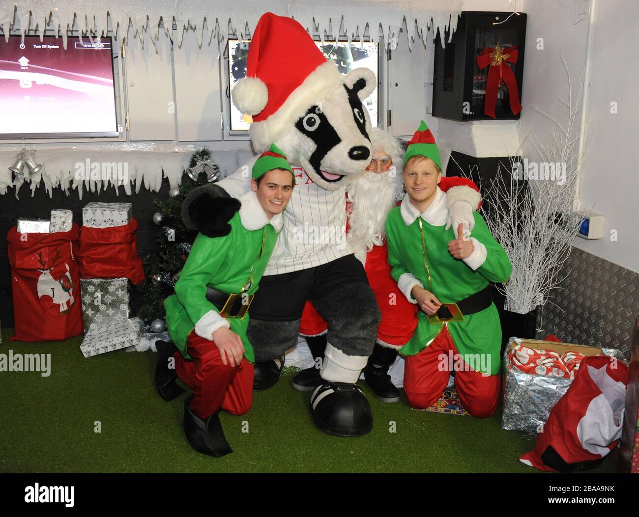 Santa Claus and Billy the Badger with two elves during Christmas at the ...