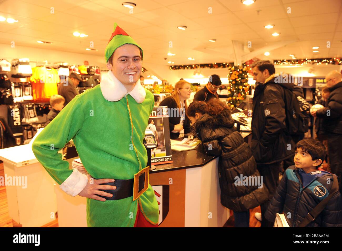 A staff member dressed as an elf during Christmas at the Cottage Stock ...