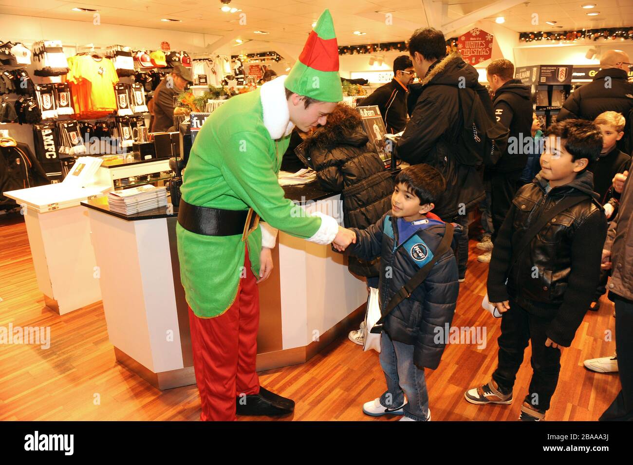 A staff member dressed as an elf during Christmas at the Cottage Stock ...
