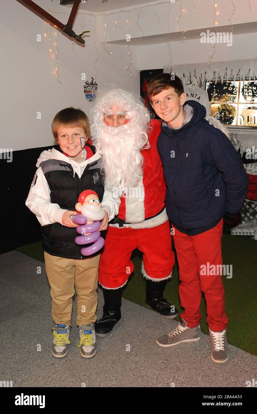 Santa Claus with young fans during Christmas at the Cottage Stock Photo ...