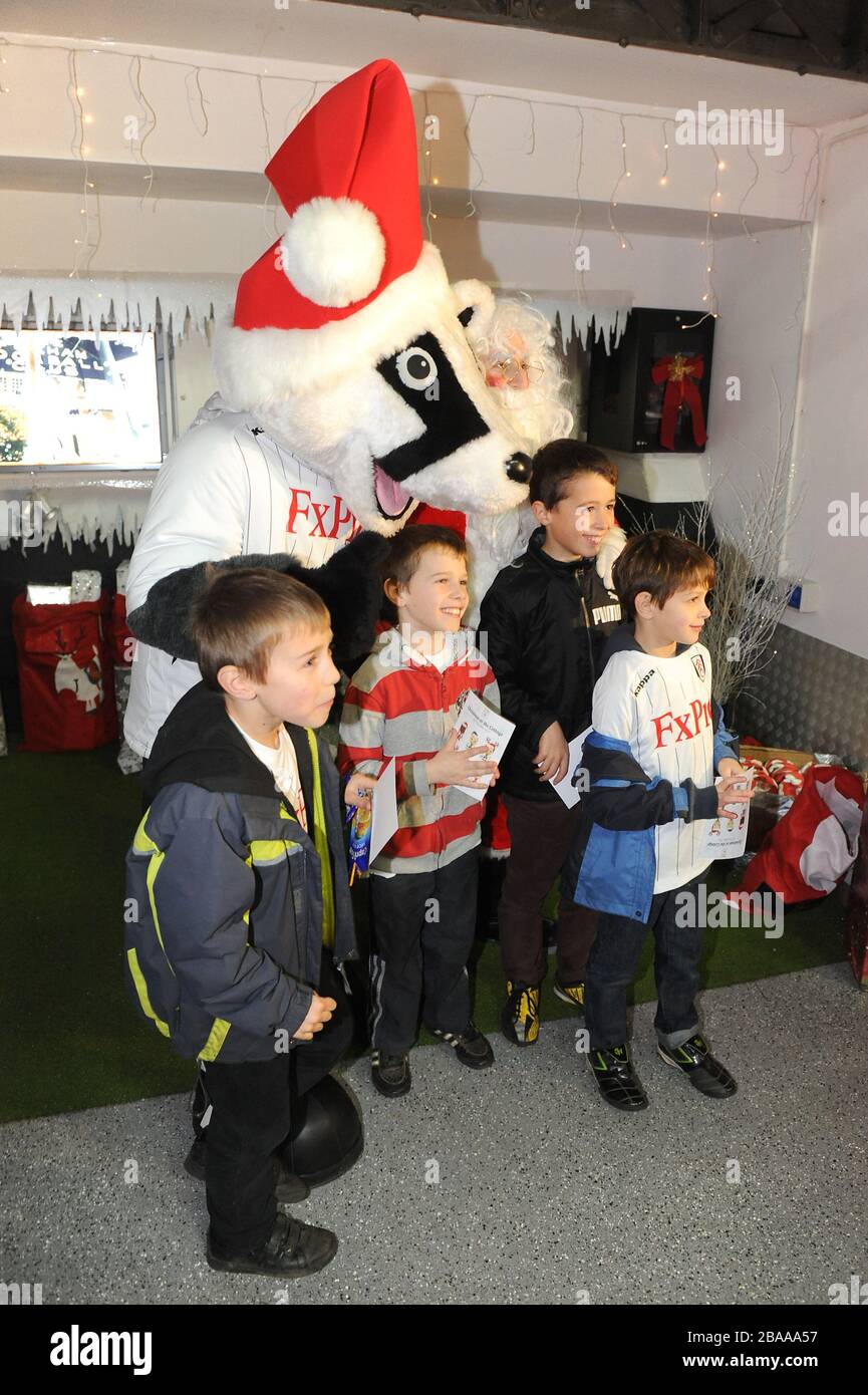 Fulham mascot Billy the Badger poses for photographs with young fans ...
