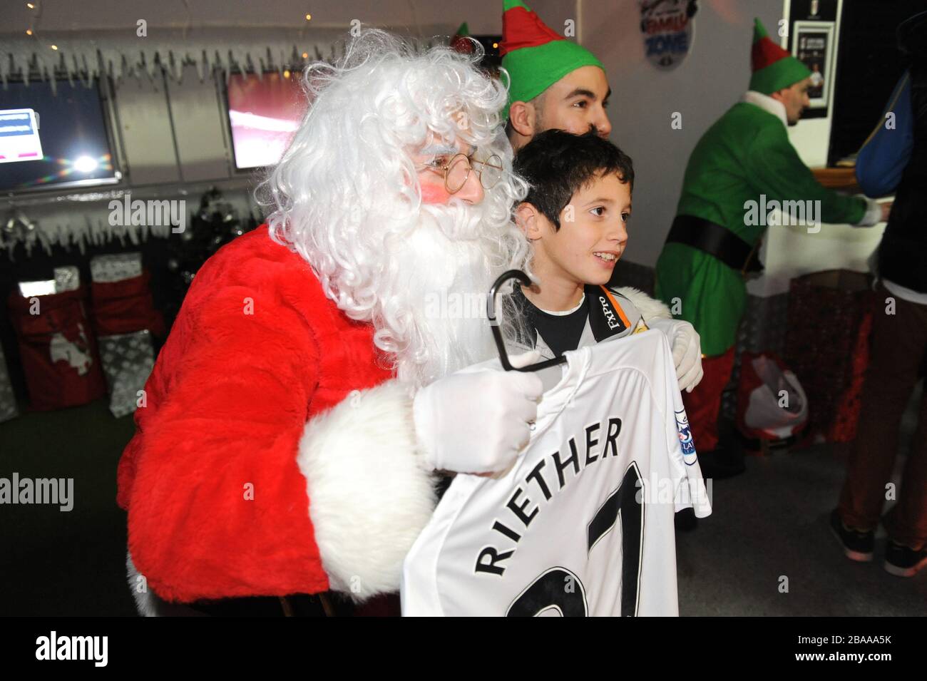 Santa Claus with a young fan during Christmas at the Cottage Stock ...