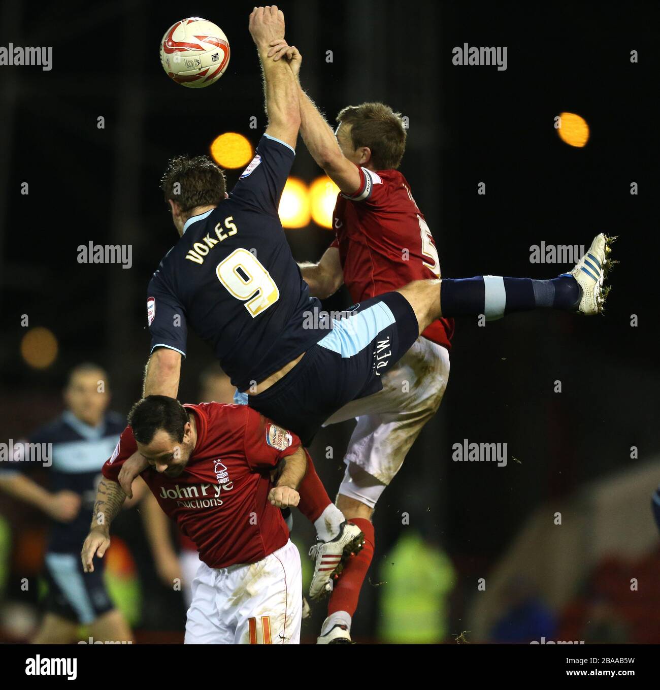 Nottingham Forest's Danny Collins and Andy Reid and Burnley's SAm Vokes ...