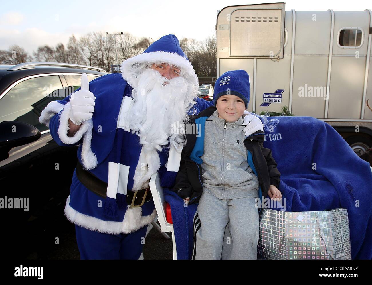 A young Everton fan with Santa outside Goodison Park before the game ...