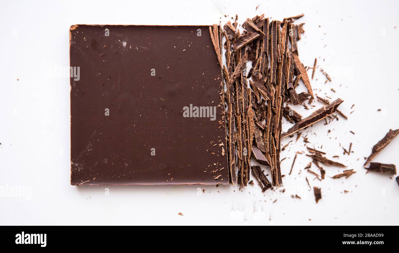 Broken craked chocolate parts isolated on white background Stock Photo ...