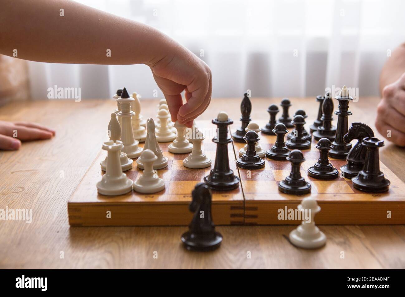 Boy playing chess with his dad hi-res stock photography and images - Alamy