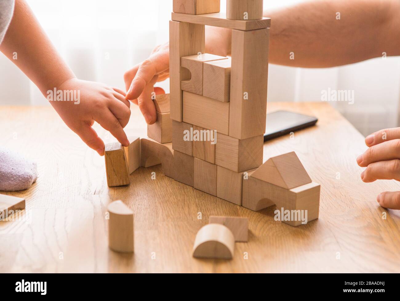 Young dad play with building bricks with small son Stock Photo - Alamy