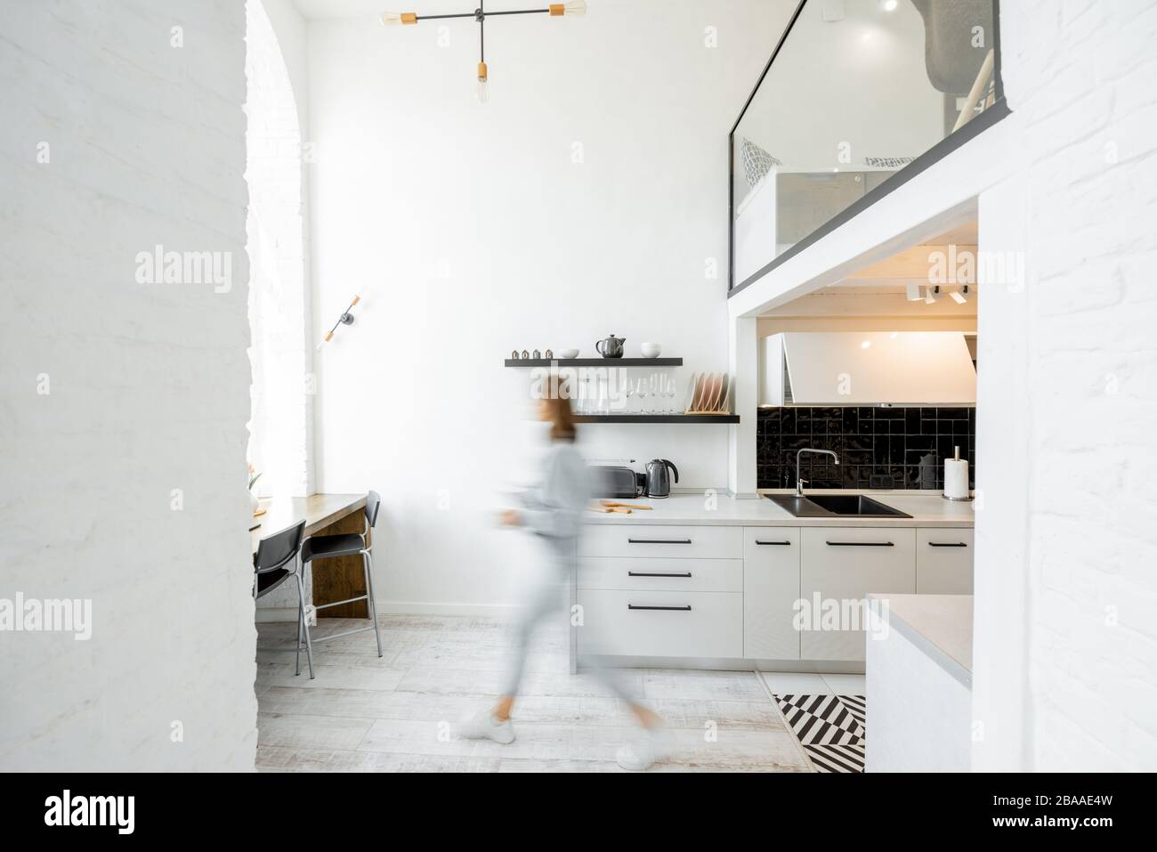 Interior view of the bright and modern kitchen with a blurred in motion ...
