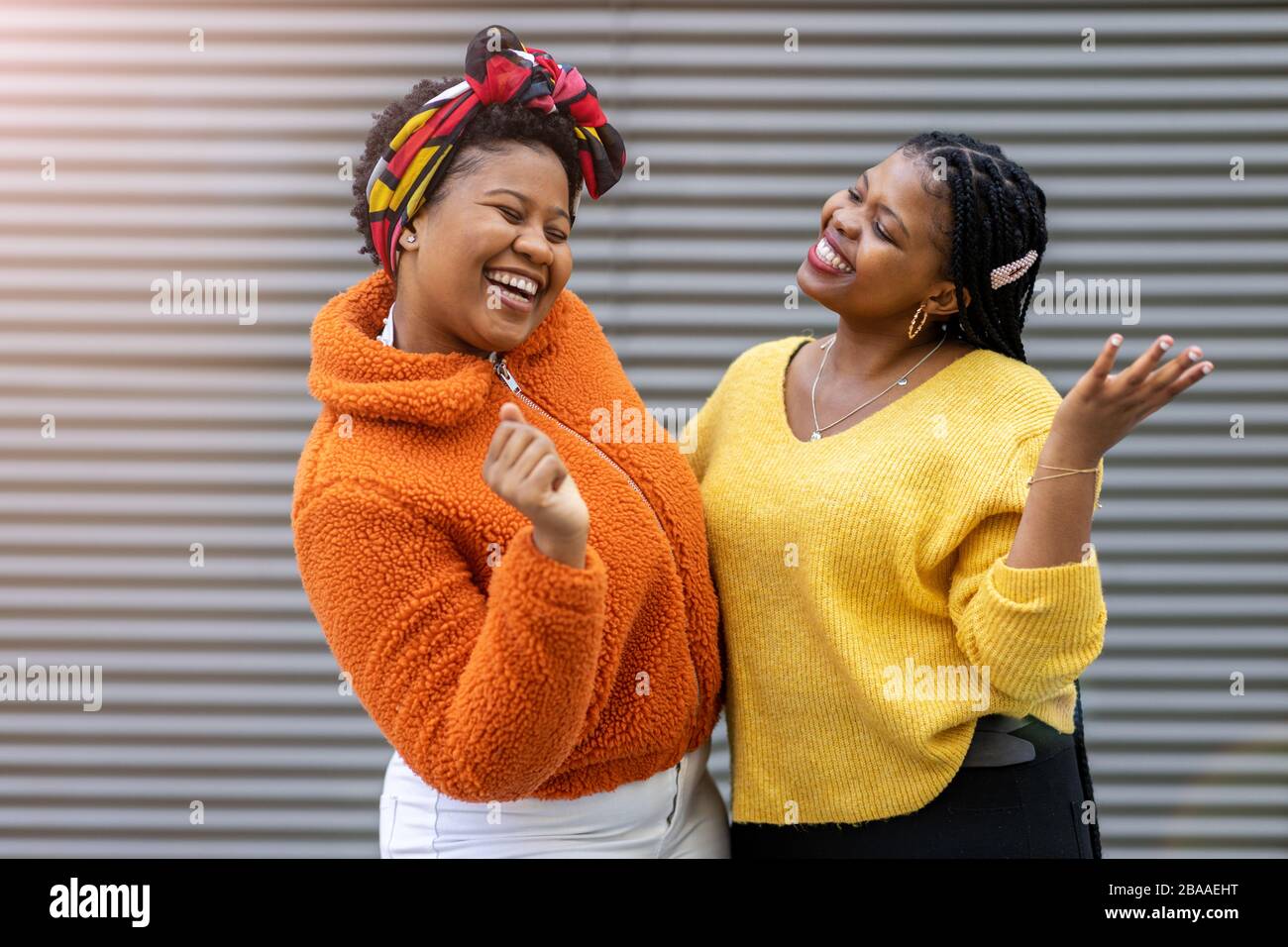 Two beautiful Afro american women in an urban city area Stock Photo - Alamy