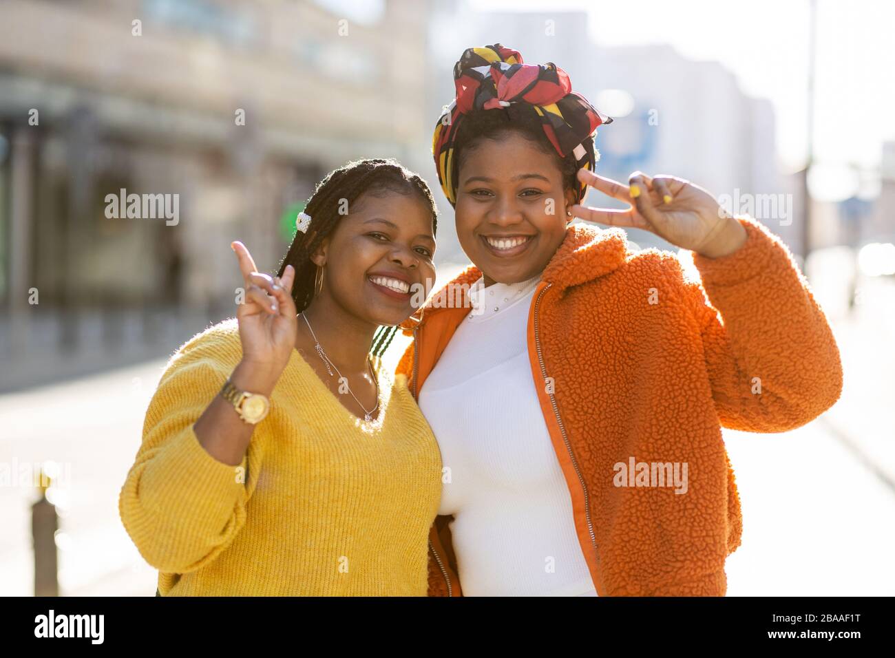 Two beautiful Afro american women in an urban city area Stock Photo - Alamy