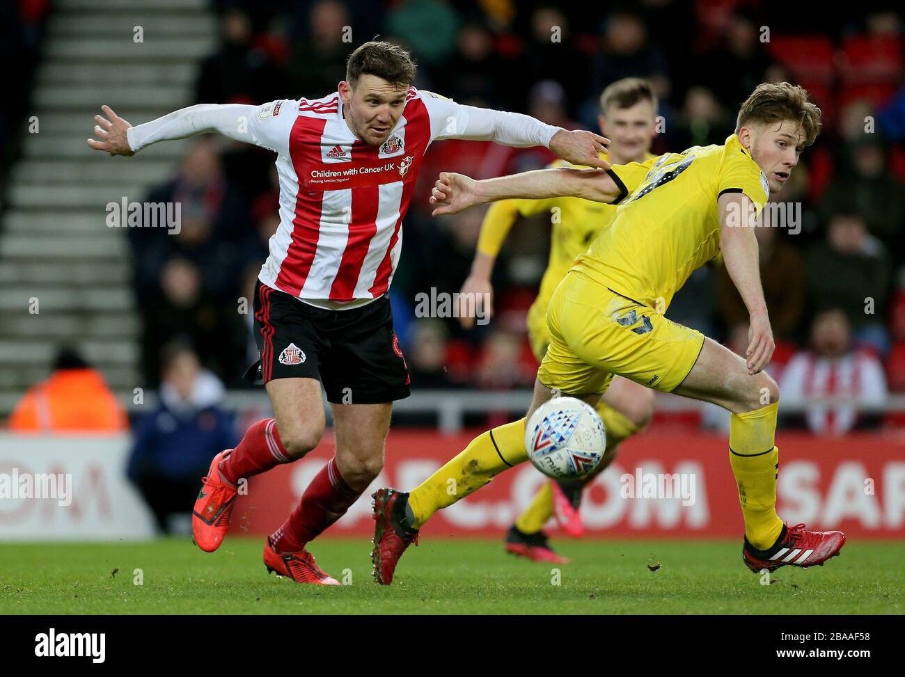 Sunderland's Charlie Wyke (left) and Fleetwood Town's Lewis Gibson ...