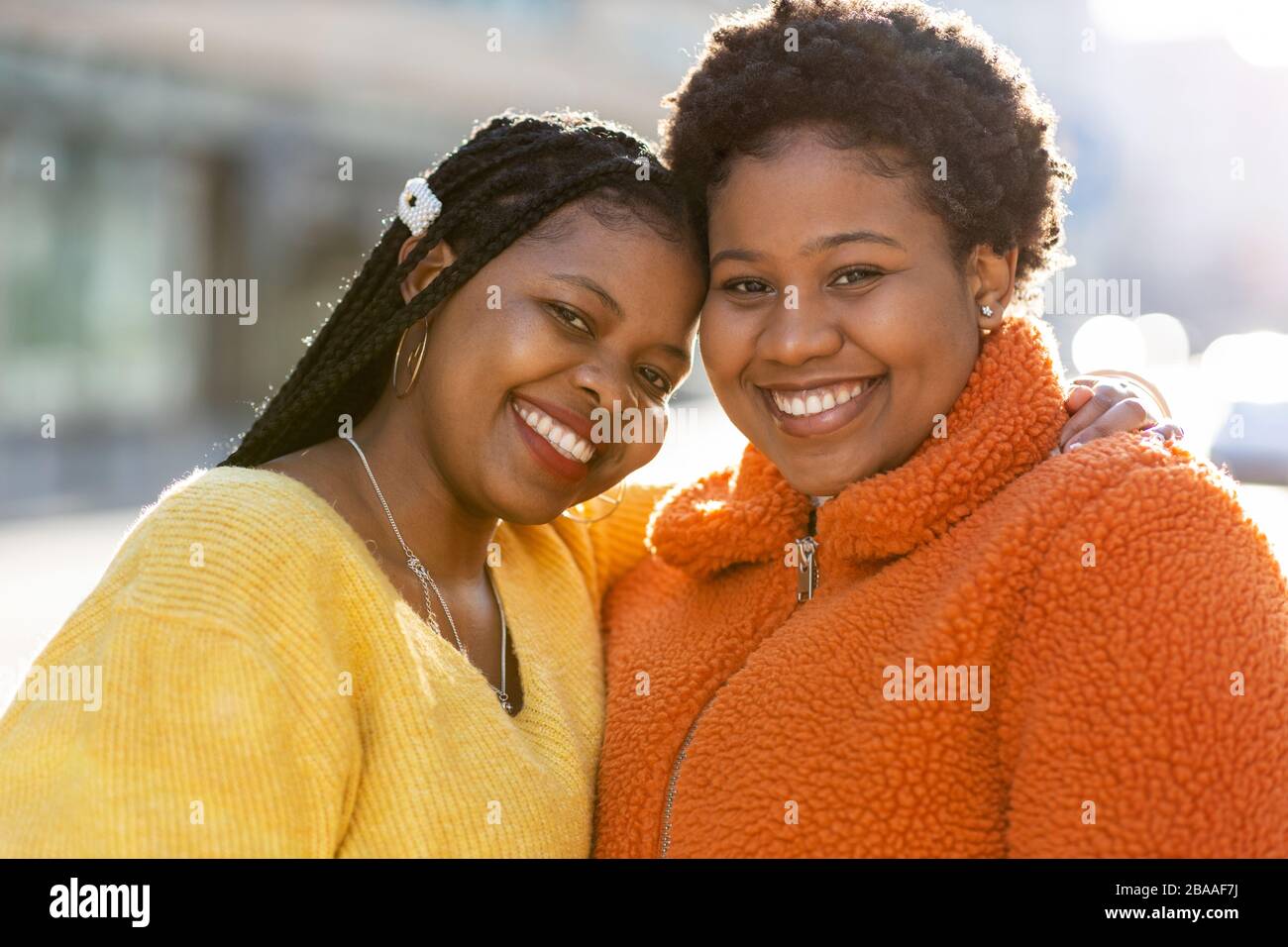 Two beautiful Afro american women in an urban city area Stock Photo - Alamy