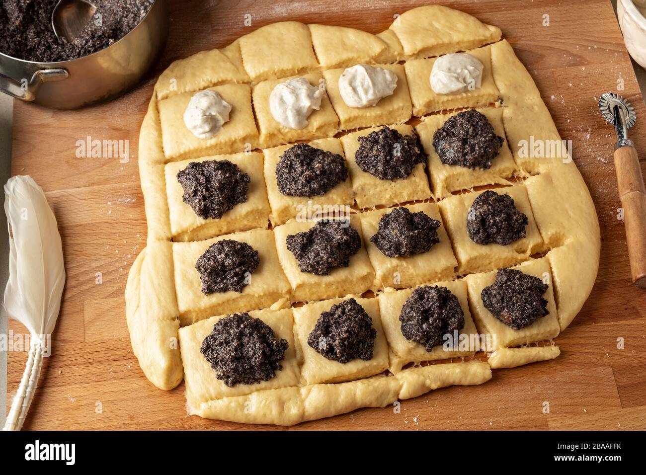 Preparation of buchty, traditional Czech sweet buns made of yeast dough ...