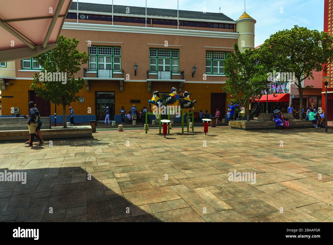 City residents and tourists on street with beautiful architecture ...