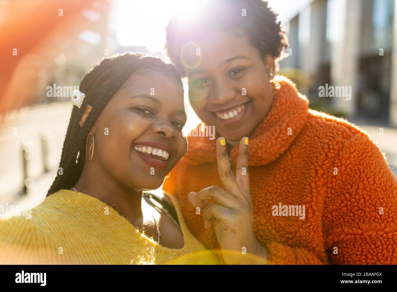 Two beautiful Afro american women in an urban city area Stock Photo - Alamy