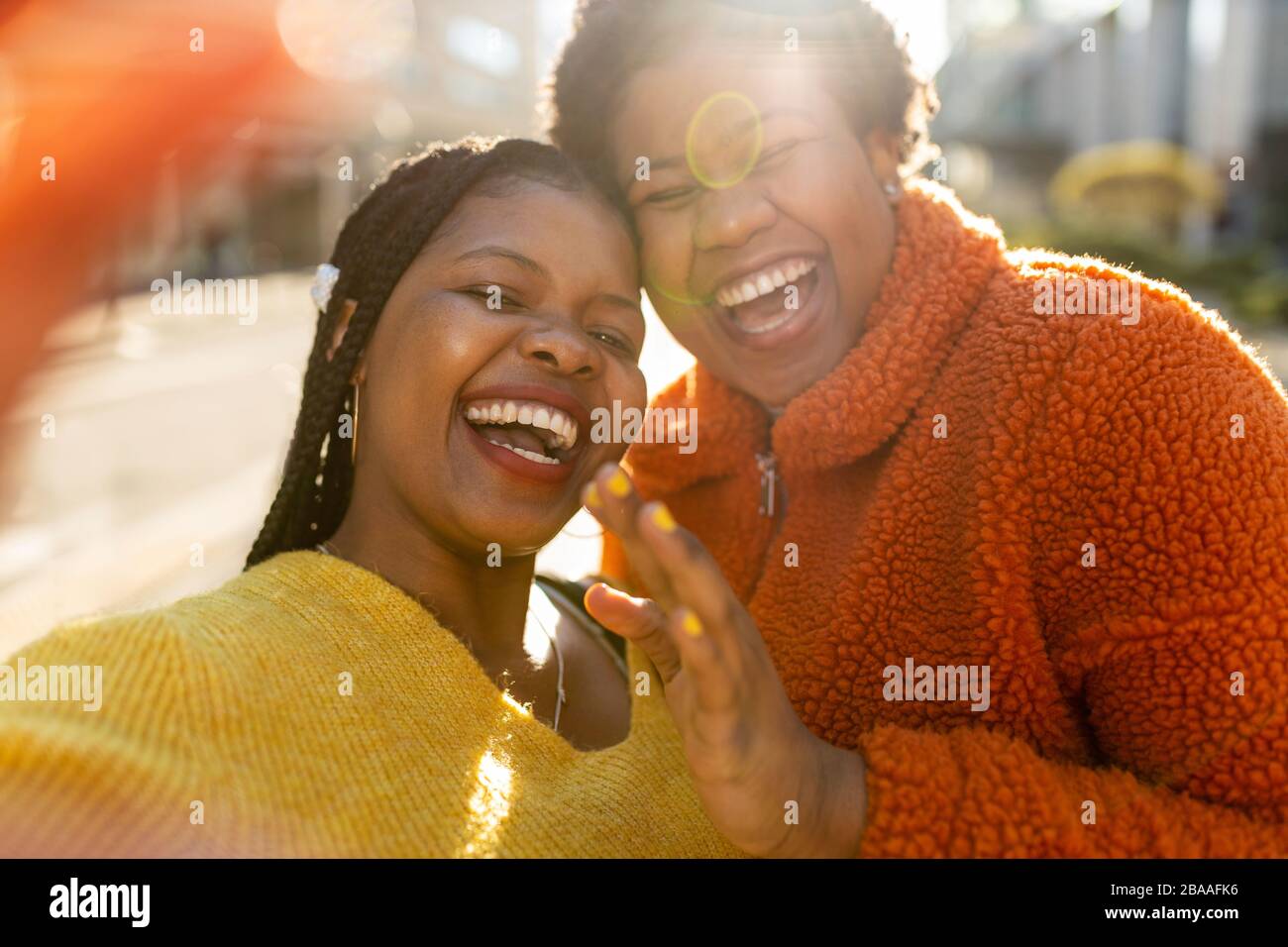 Two beautiful Afro american women in an urban city area Stock Photo - Alamy