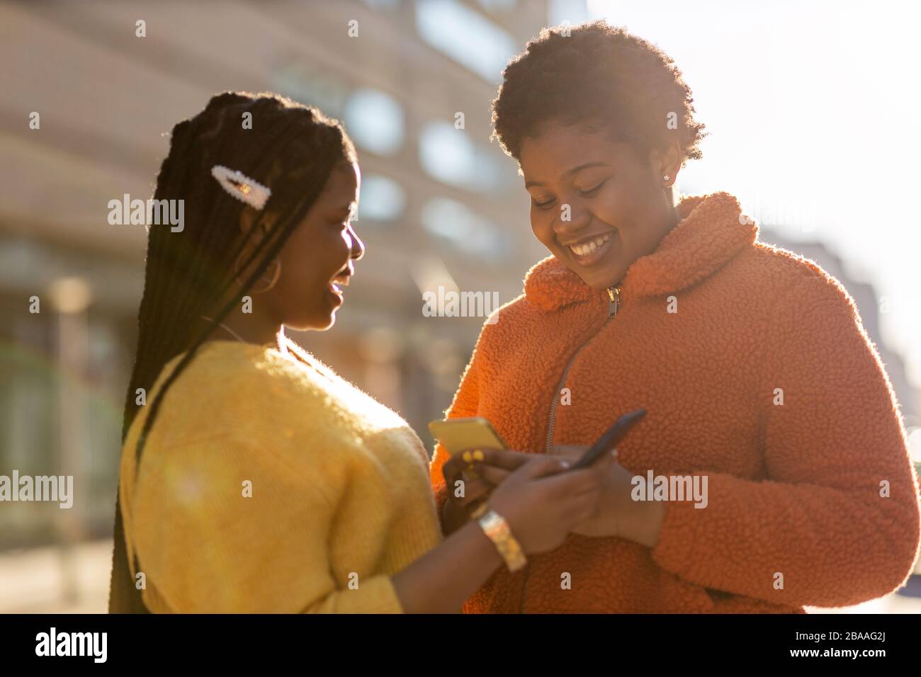 Two beautiful Afro american women in an urban city area Stock Photo - Alamy