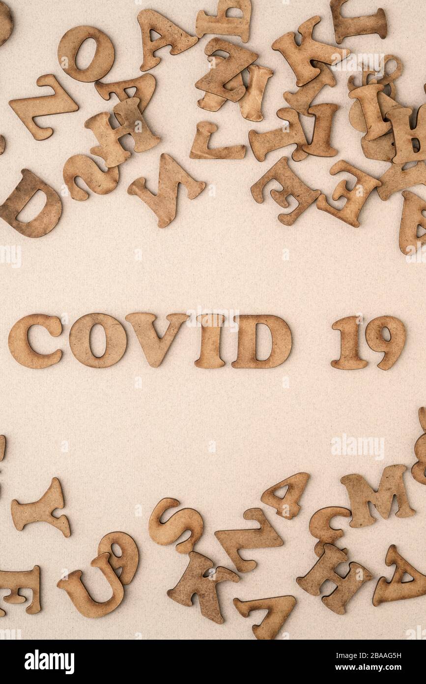 Epidemic corona virus covid-19 written with carved wooden letters Stock ...