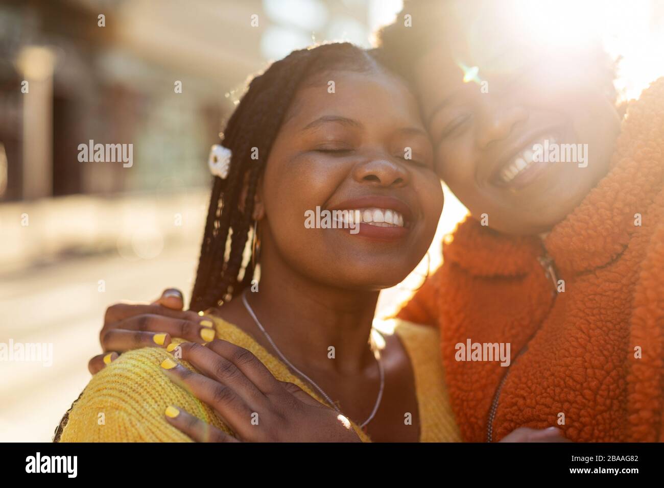Two beautiful Afro american women in an urban city area Stock Photo - Alamy