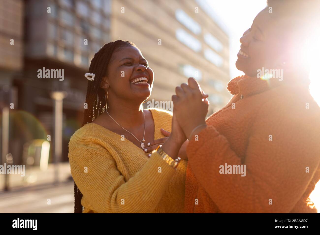 Two beautiful Afro american women in an urban city area Stock Photo - Alamy