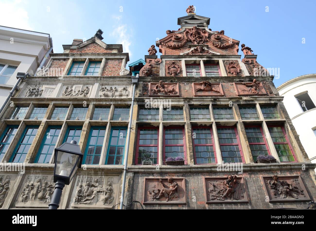 Stone sculptures on traditional facades in the Old Town of Ghent, the ...