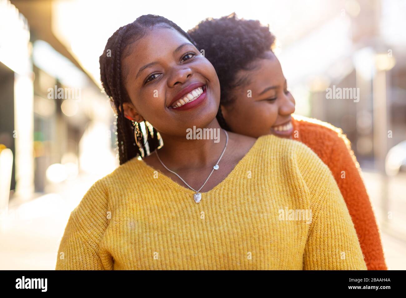 Two beautiful Afro american women in an urban city area Stock Photo - Alamy