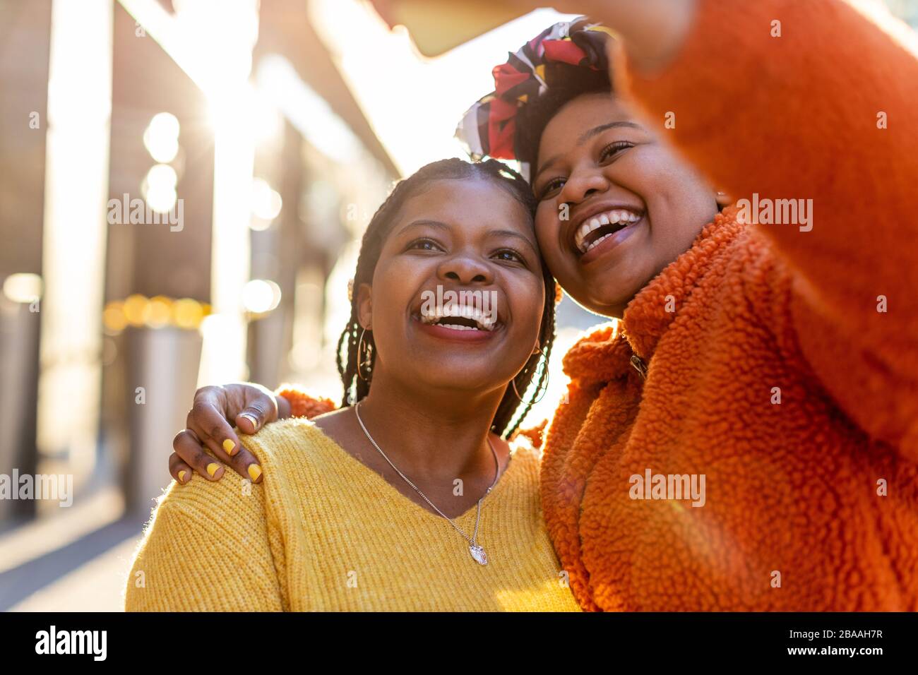 Two beautiful Afro american women in an urban city area Stock Photo - Alamy