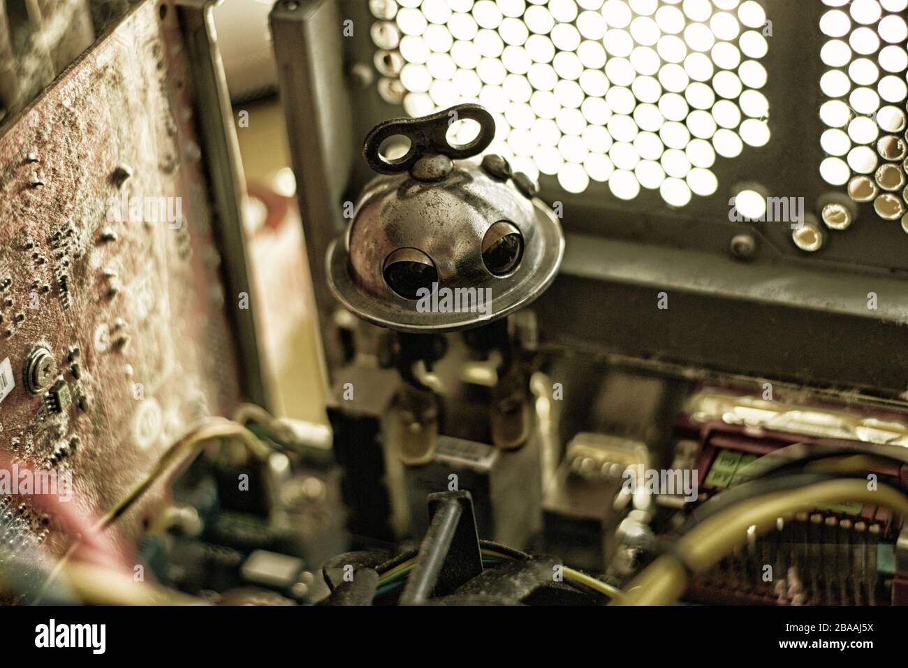 Beautiful photo of little robot repairing computer Stock Photo - Alamy