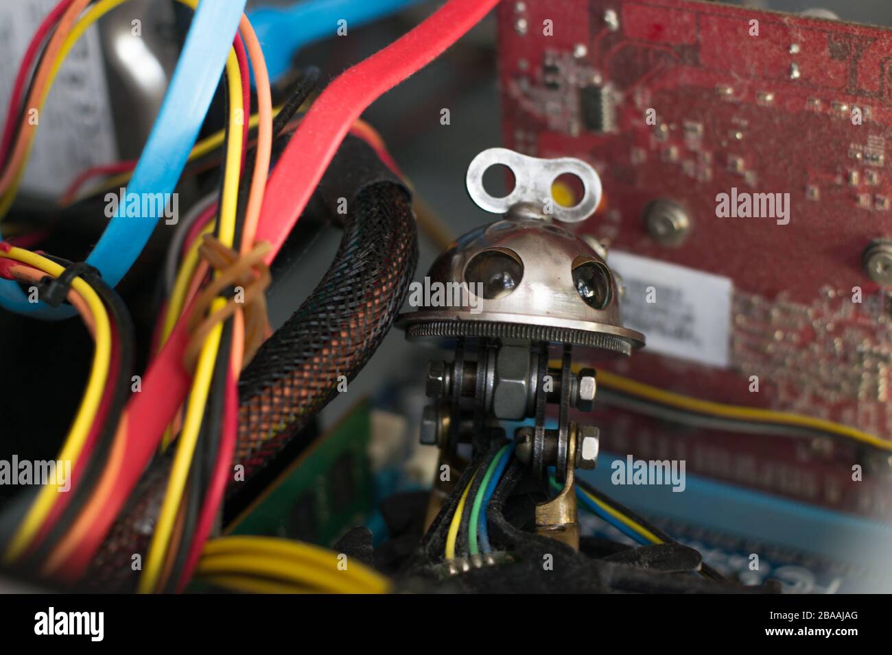 Beautiful photo of little robot repairing computer Stock Photo - Alamy