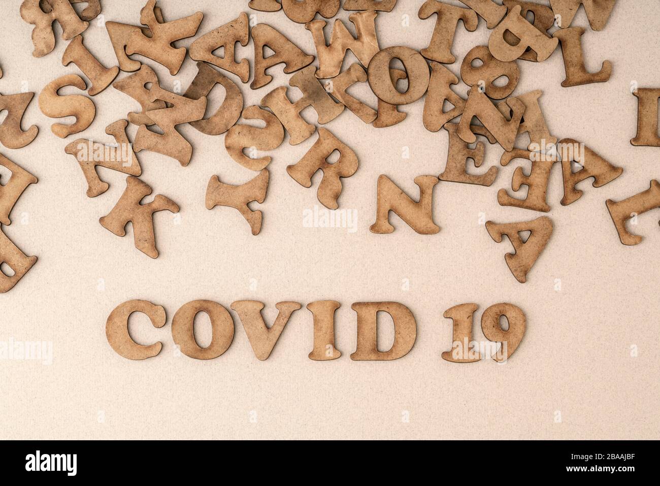 Epidemic corona virus covid 19 written with carved wooden letters Stock ...