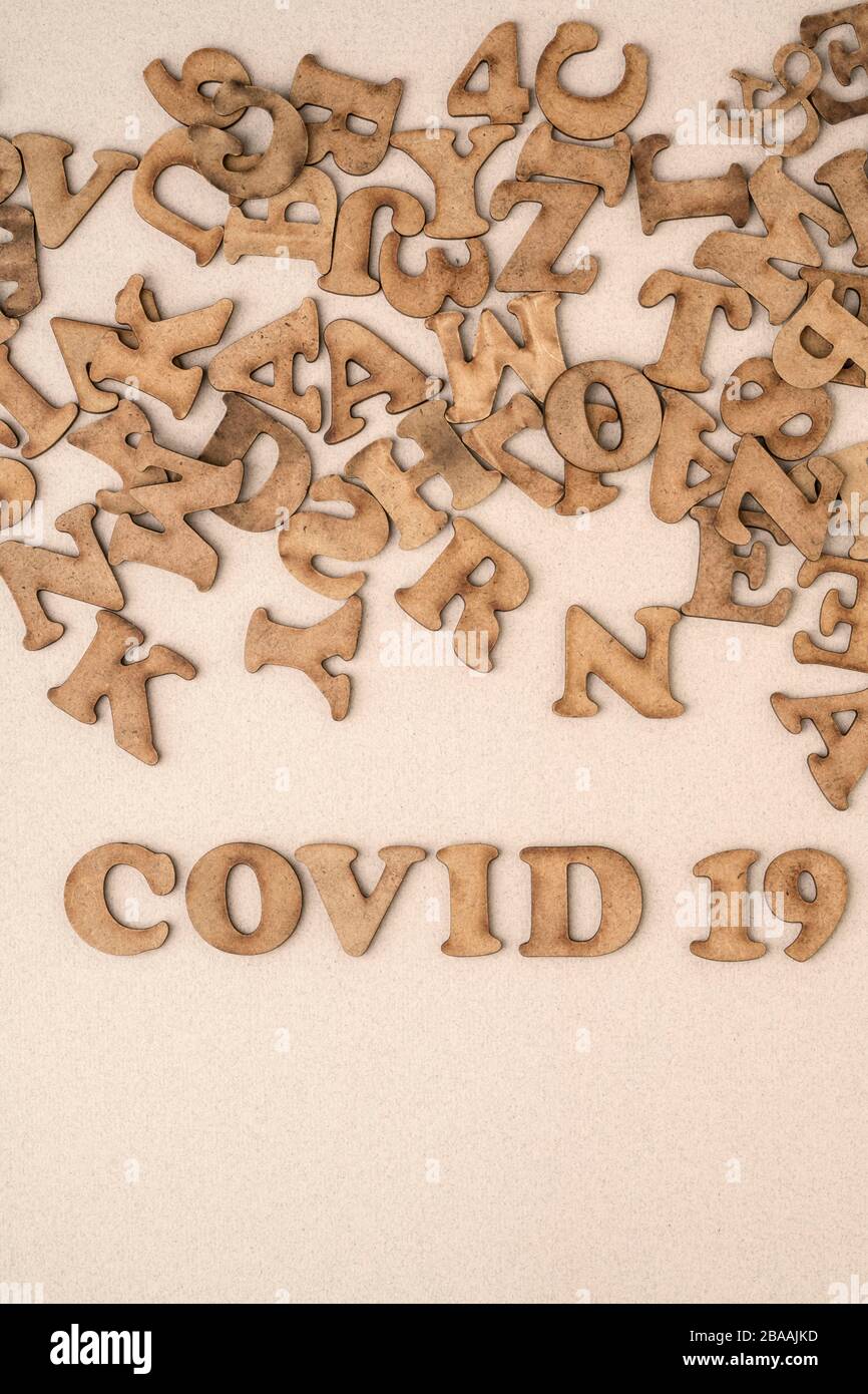 Epidemic corona virus covid 19 written with carved wooden letters Stock ...