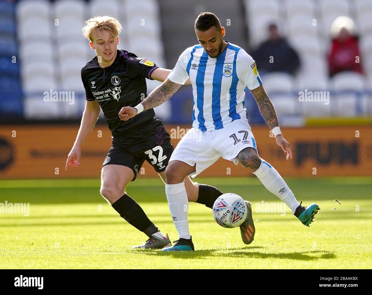 Charlton Athletic's George Lapslie (left) and Huddersfield Town's Rajiv ...