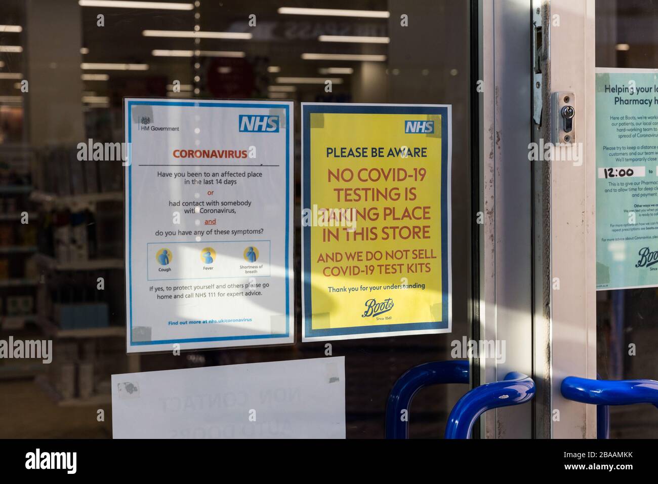 COVID-19 Boots no testing signs Stock Photo - Alamy