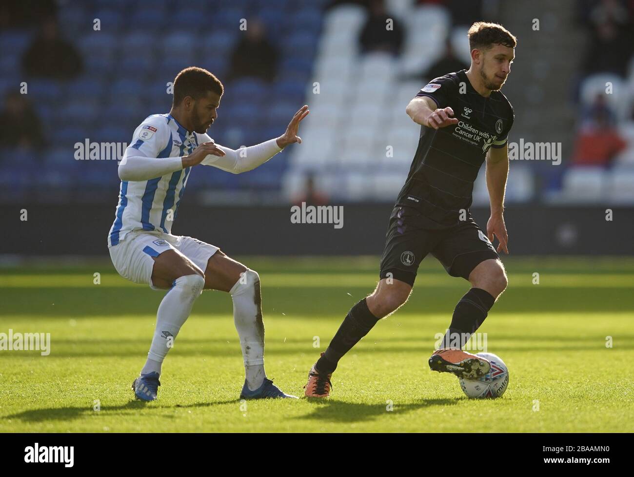 Charlton Athletic's Jason Pearce, right, and Huddersfield Town's ...