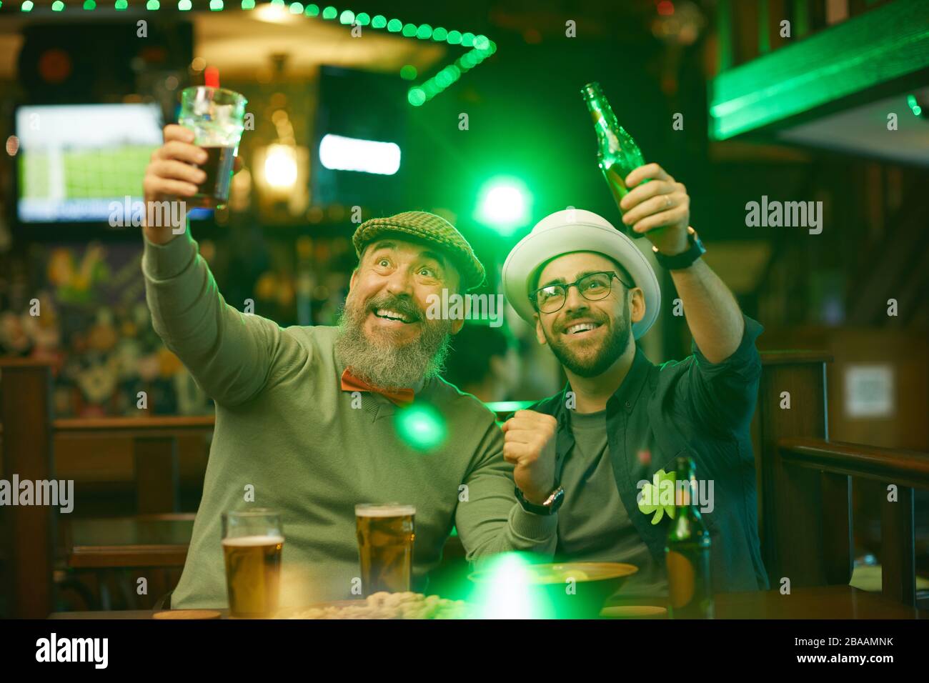 Men raising glasses hi-res stock photography and images - Alamy