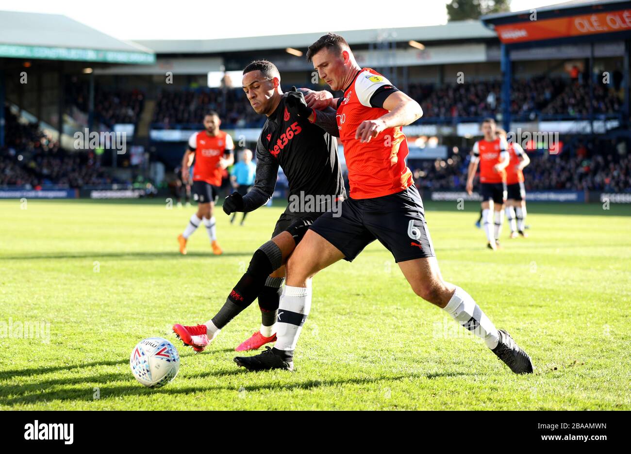 Stoke City's Tom Ince battles with Luton Town's Matty Pearson (right ...