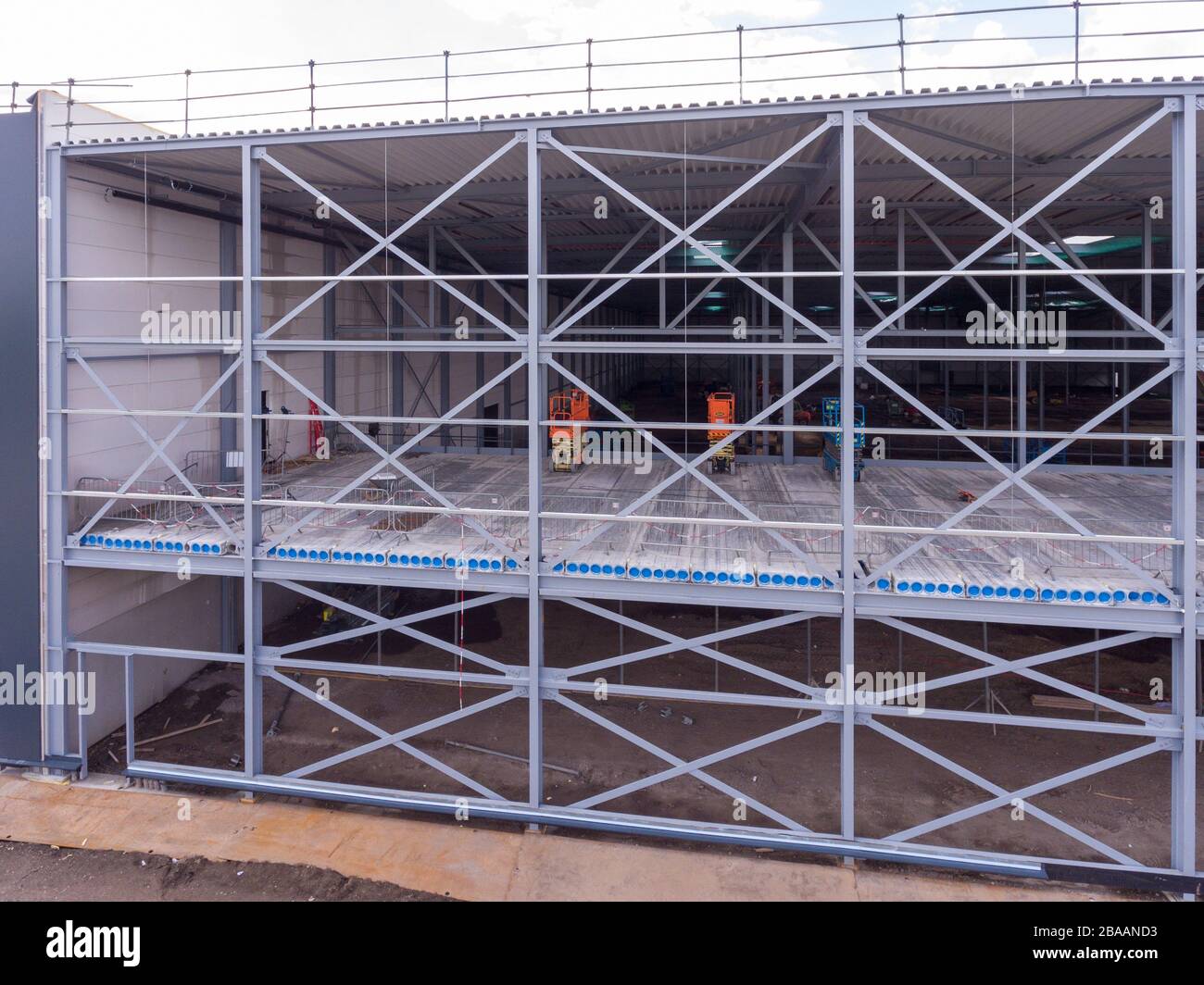 Construction process of a warehouse during daytime Stock Photo - Alamy