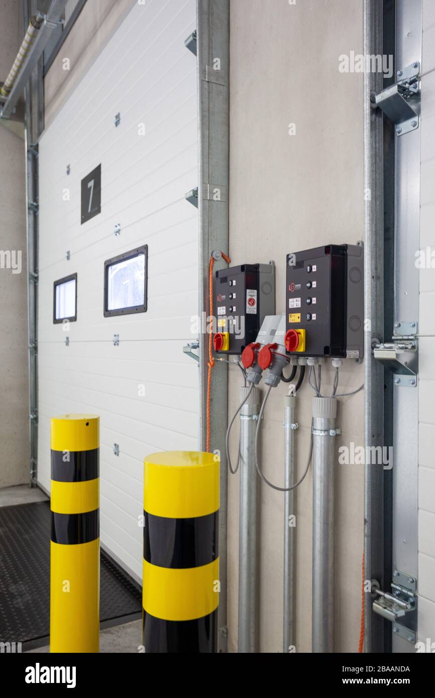Vertical shot of the control panels for loading bay doors inside a ...